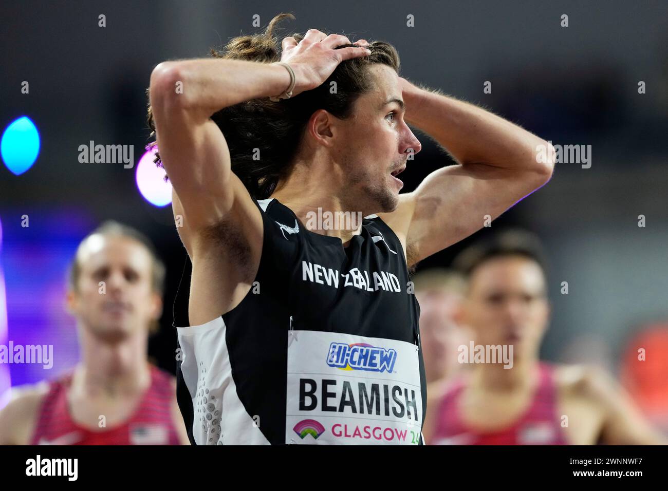 Geordie Beamish, of New Zealand, reacts after crossing the finish line ...