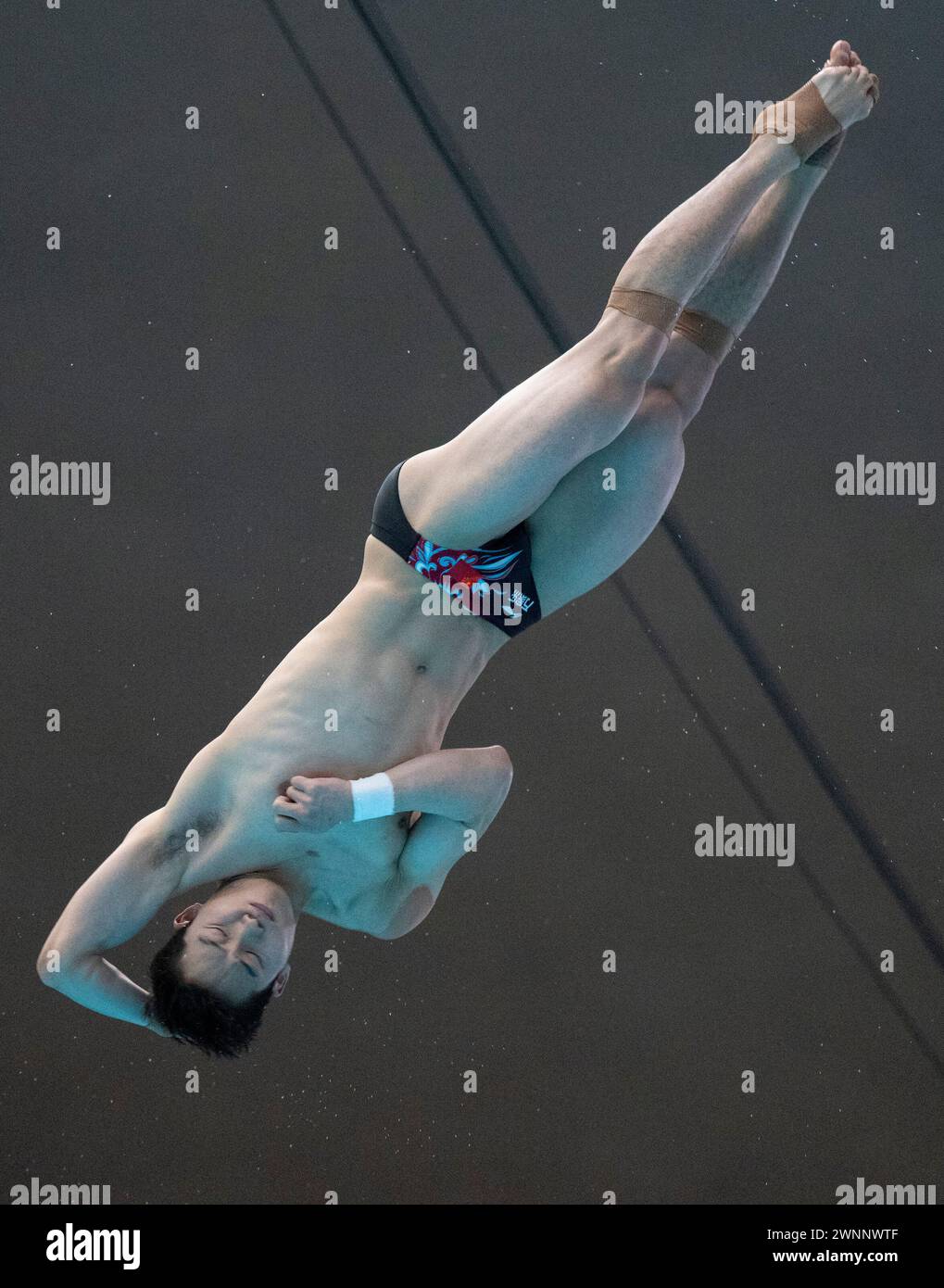 Wang Zongyuan, of China, competes during the men's 3m springboard final ...