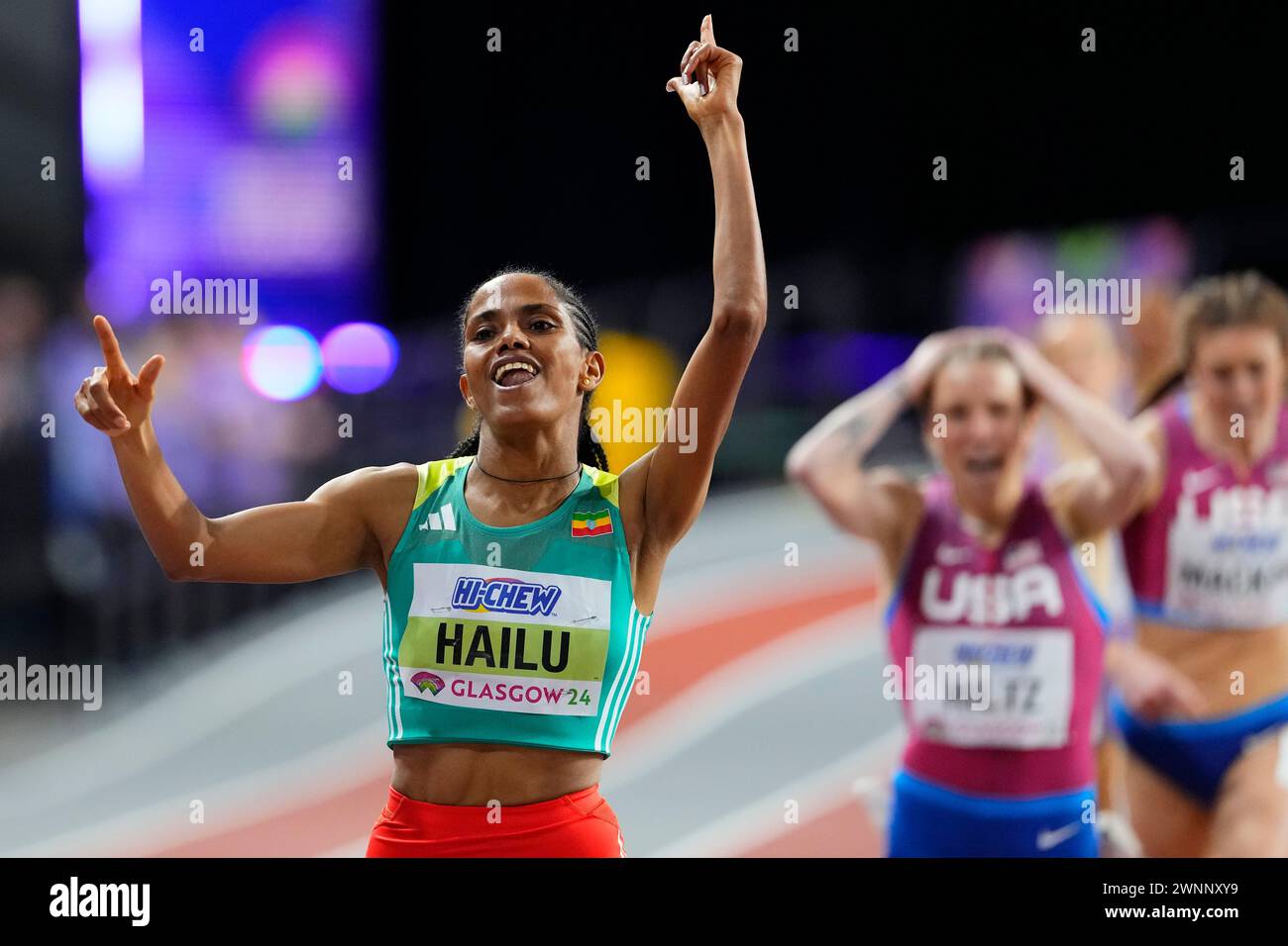 Freweyni Hailu, of Ethiopia, crosses the finish line to win the gold medal, ahead of Nikki Hiltz ...