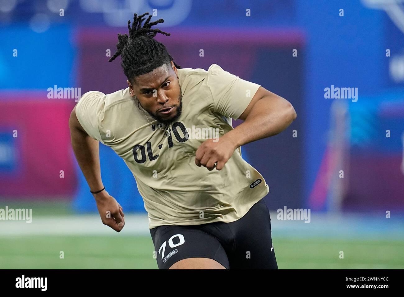Penn State offensive lineman Caedan Wallace runs a drill at the NFL ...