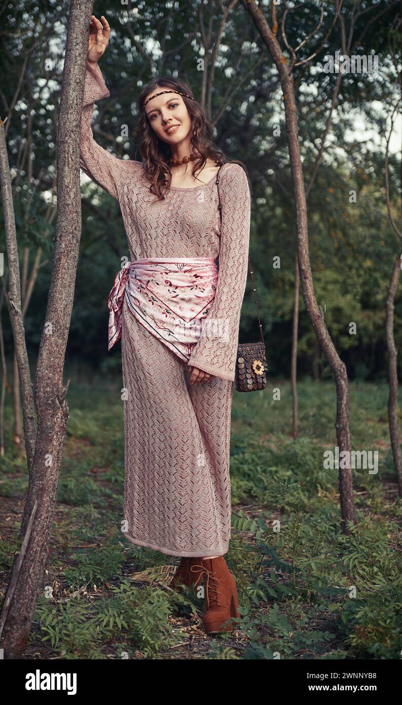 Outdoor portrait of the beautiful young boho (hippie) girl in grove ...