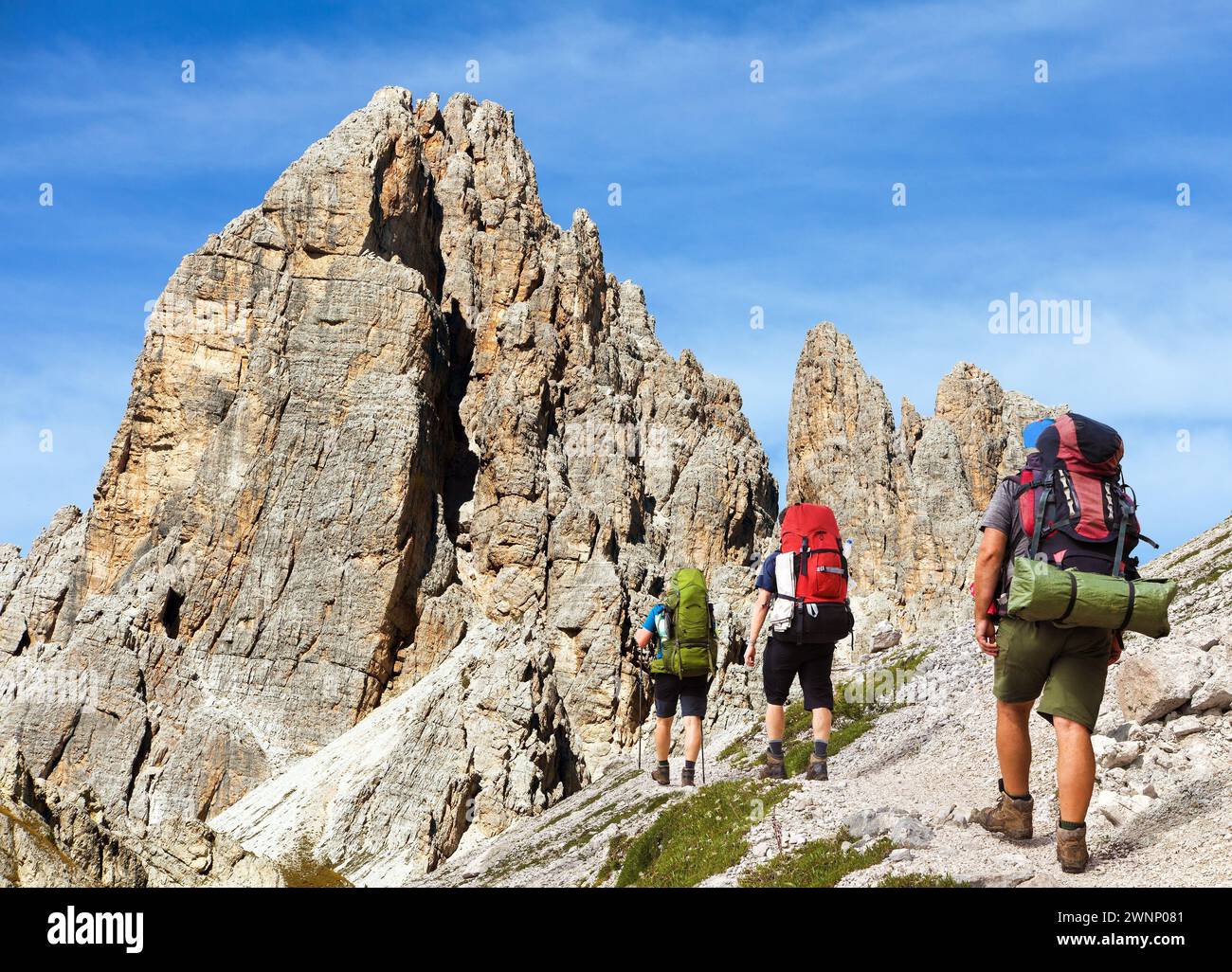 Cima Ambrizzola and Croda da Lago with three hikers, Alps Dolomites ...