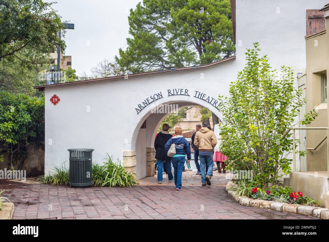 Tourists entering the historic Arneson River Theater on the River Walk ...