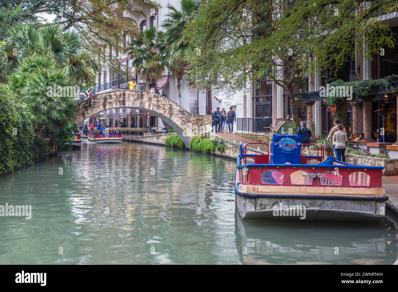 Rio San Antonio Cruises boats carry passengers through the River Walk ...