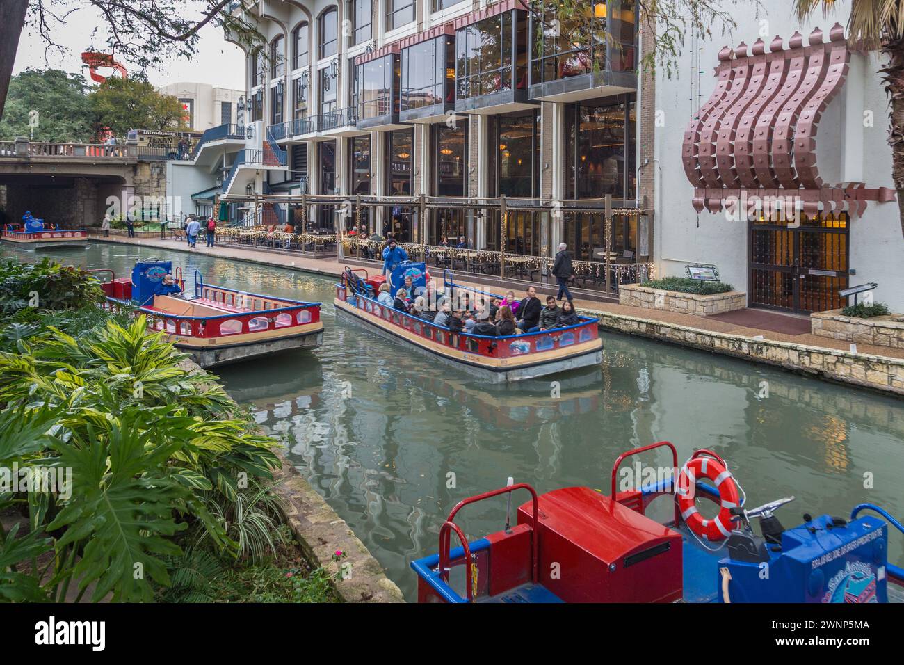 Rio San Antonio Cruises boats carry passengers through the River Walk ...