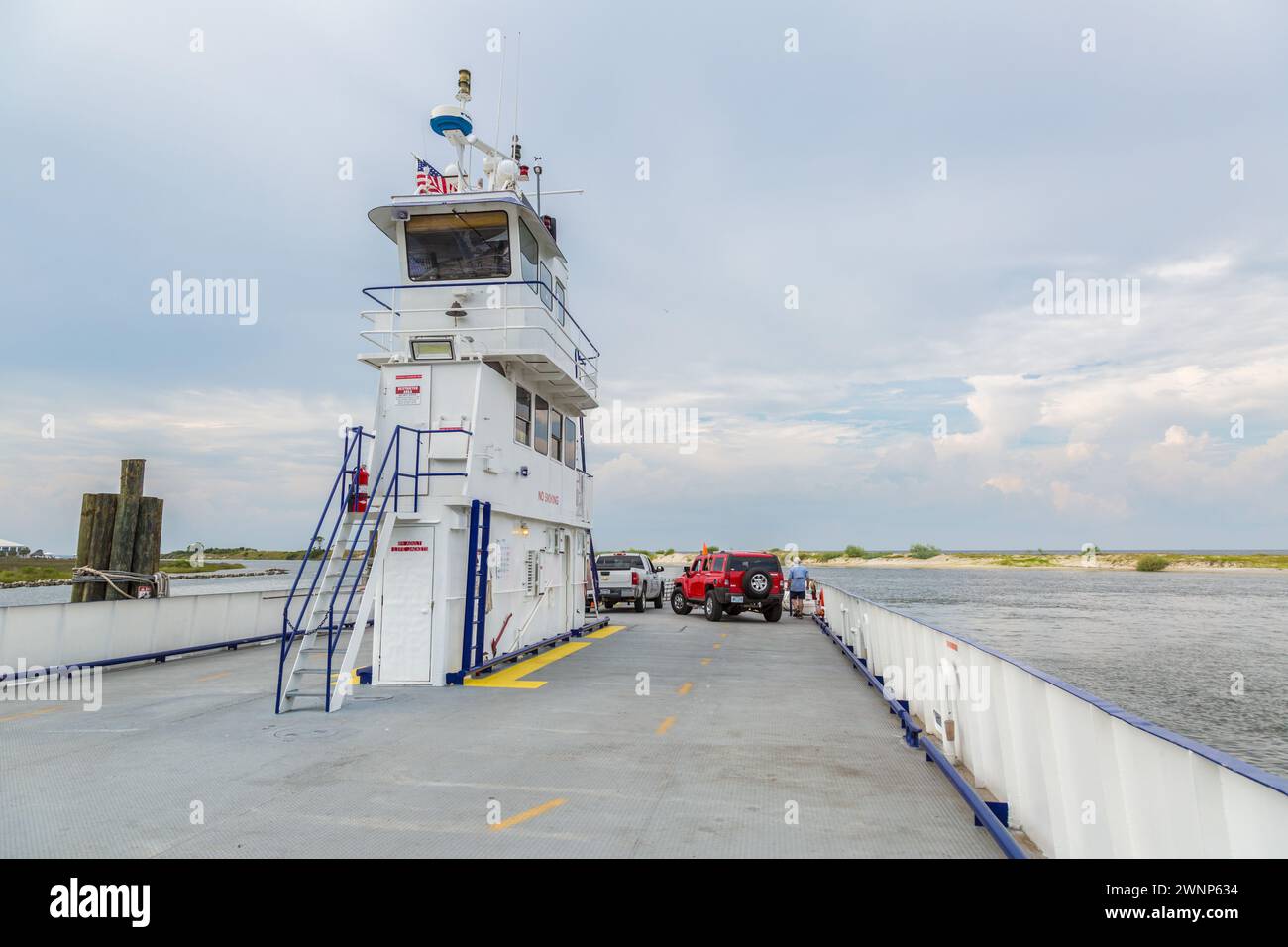 Trucks on the deck of the Mobile Bay Ferry docked at Dauphin Island ...