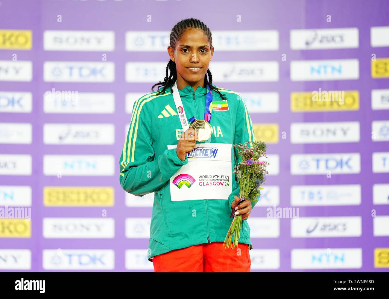 Ethiopia's Frewenyi Hailu celebrates gold on the podium for the Women's ...