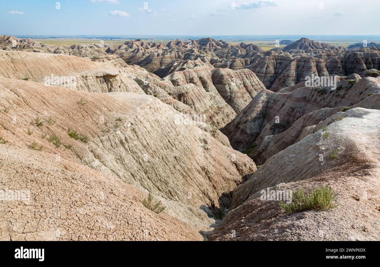 Erosion exposes colorful layers of sedimentary rock in the Badlands ...