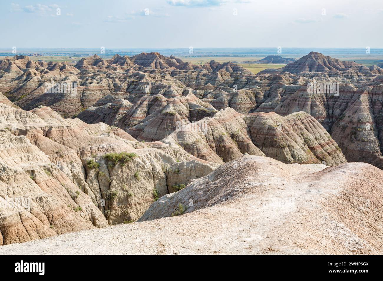 Erosion exposes colorful layers of sedimentary rock in the Badlands ...