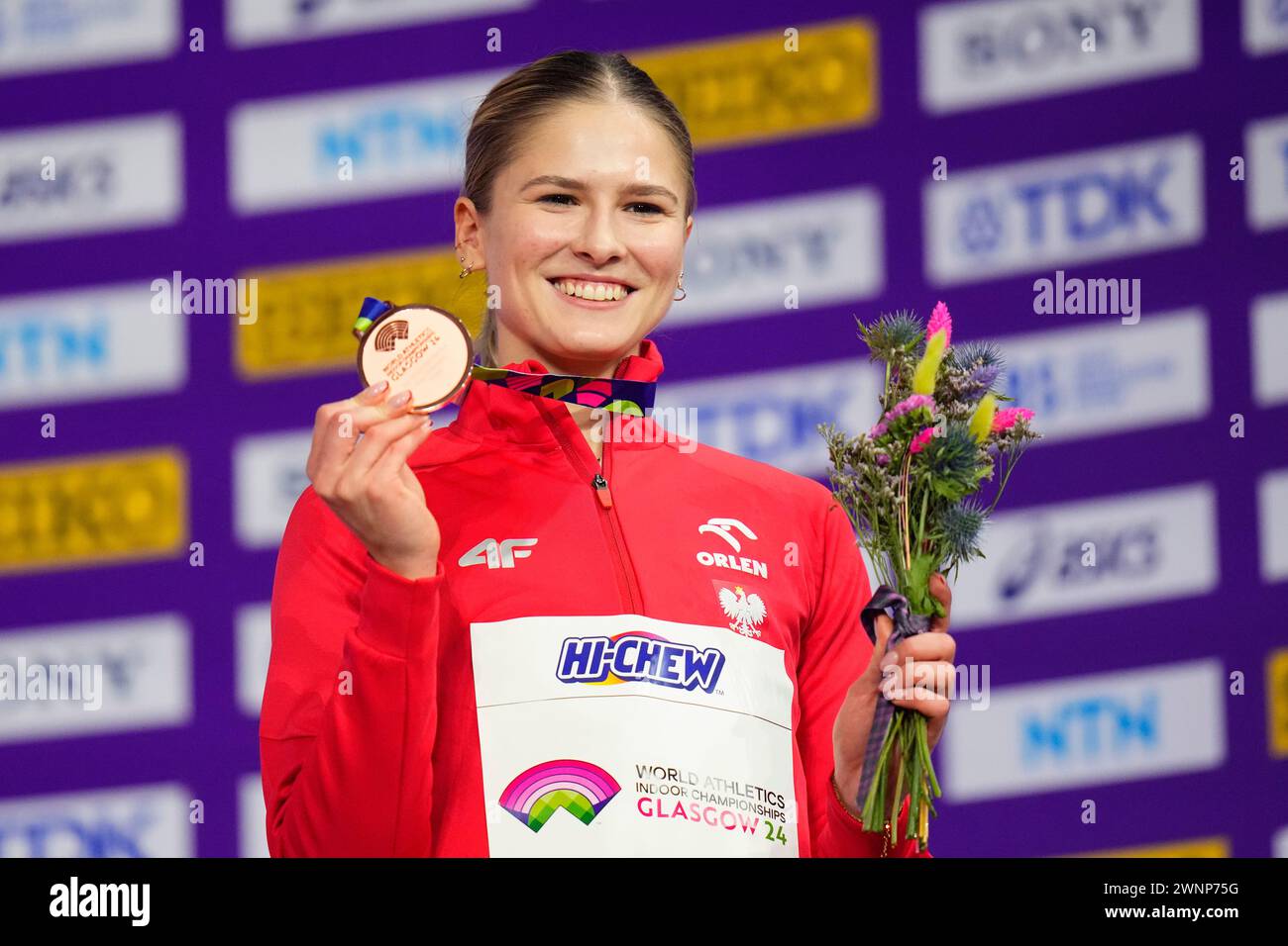 Pia Skrzyszowska, of Poland, poses on the podium after winning the ...