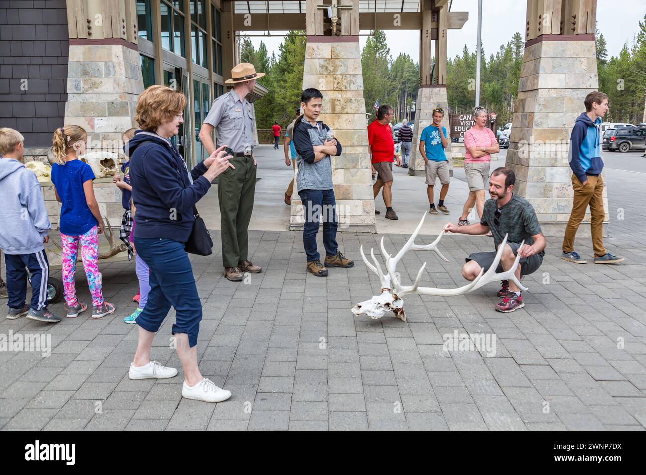Park ranger supervises young park visitors with hands-on exhibits of ...