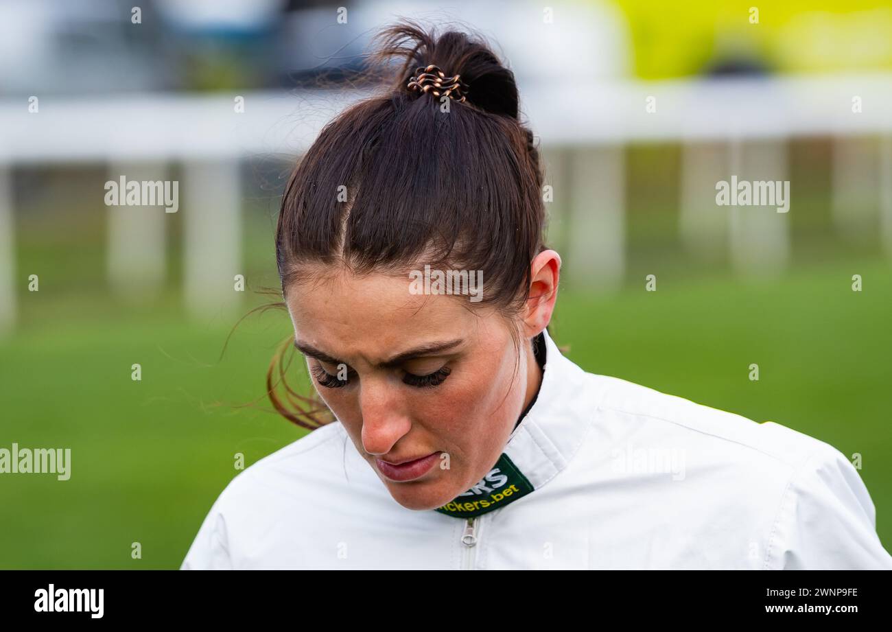 Jockey Charlotte Jones walks the track after the first race at ...
