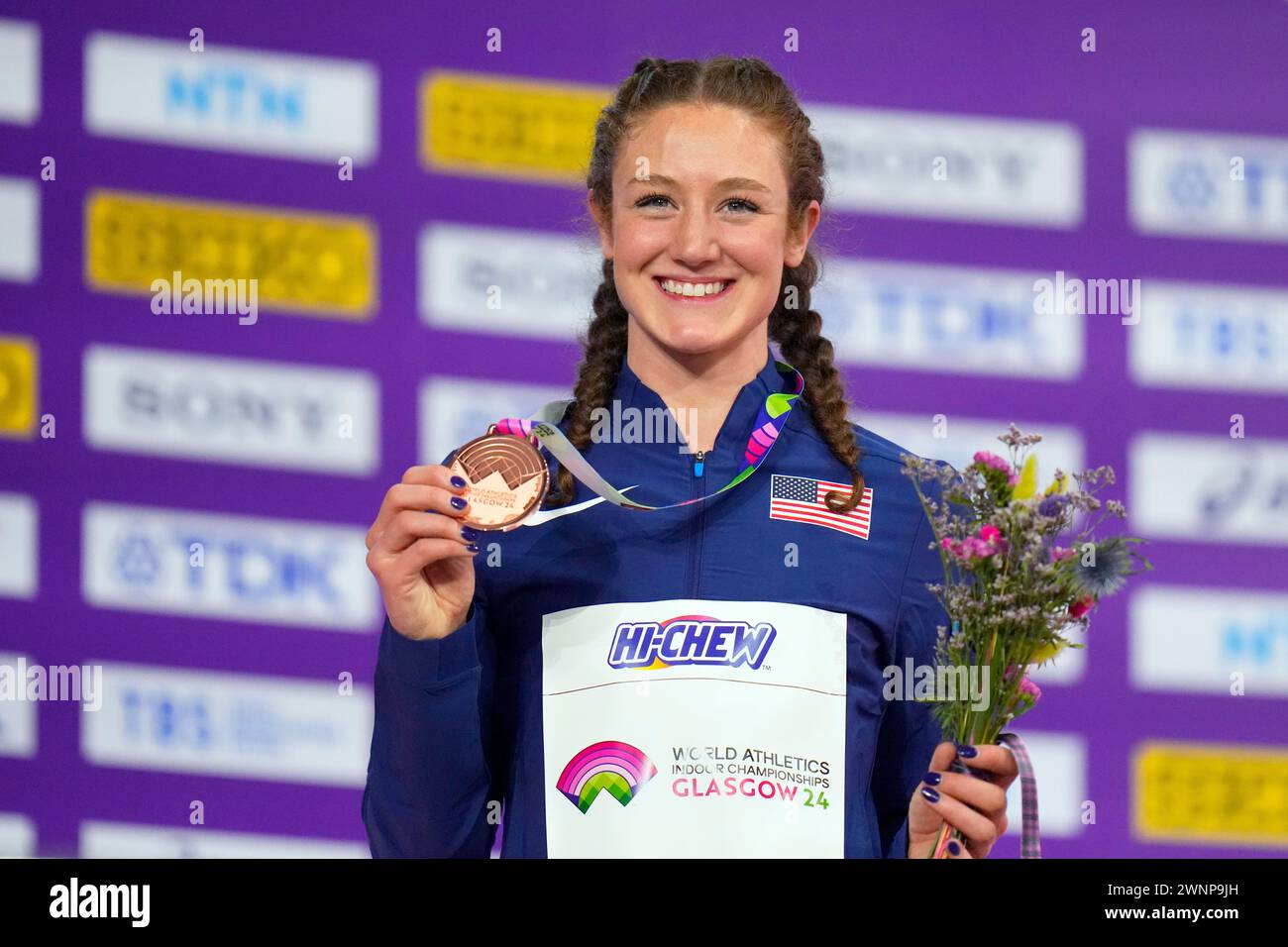 Emily Mackay, of the United States, poses on the podium after winning ...