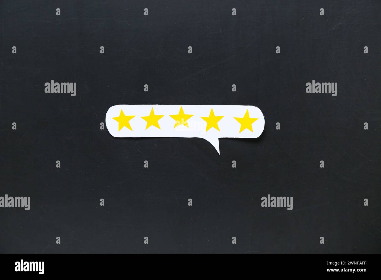 Speech bubble with five stars rating on dark background. Customer ...