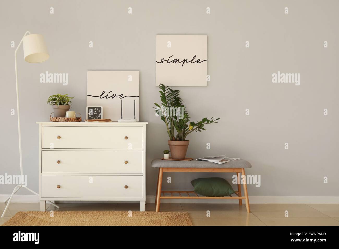 Interior of living room with modern wi-fi router on commode and bench ...
