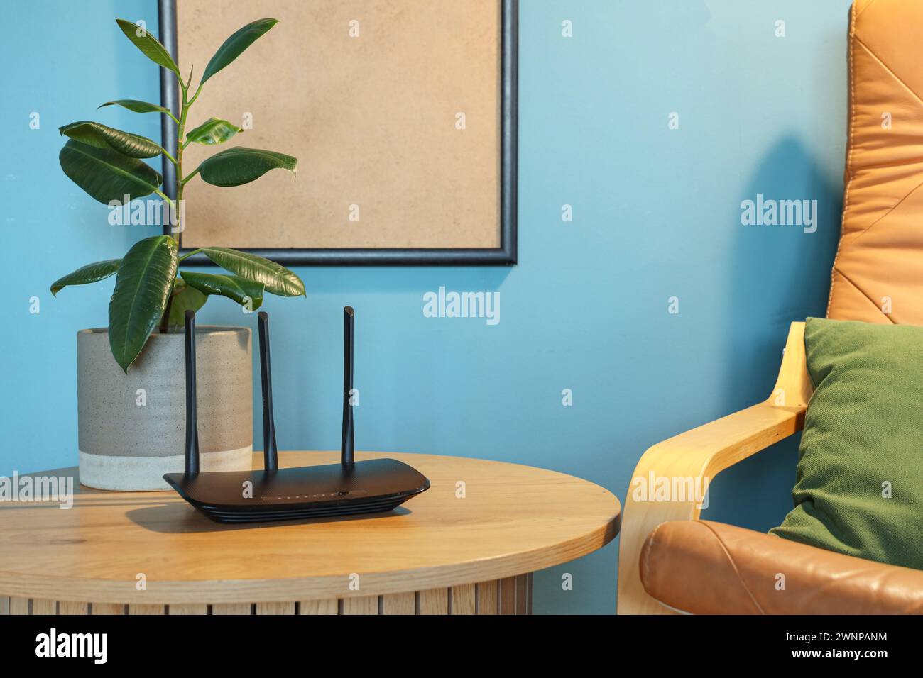 Modern wi-fi router with plant on table in living room at night Stock ...