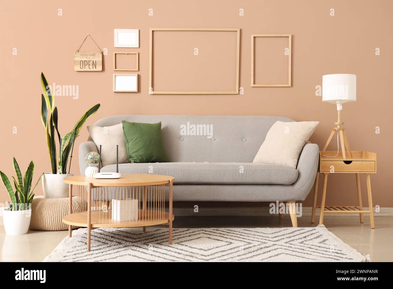 Interior of living room with sofa and wi-fi router on table Stock Photo ...