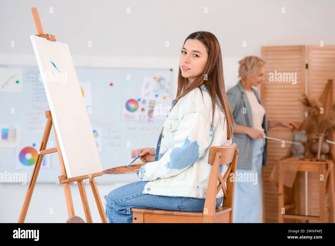 Female student drawing on canvas in art school Stock Photo - Alamy