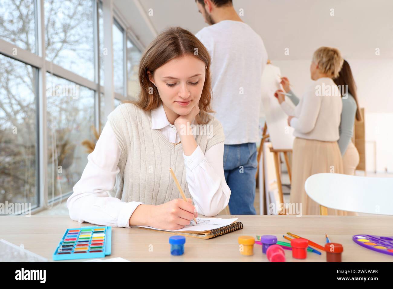 Female student drawing in art school Stock Photo - Alamy