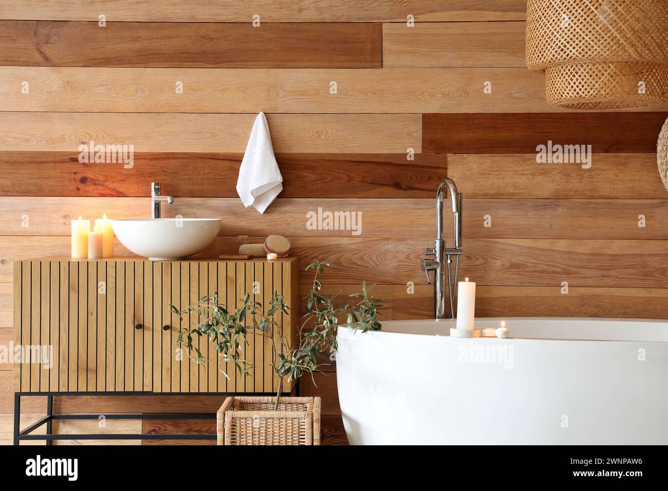 Interior of bathroom with bathtub, sink and burning candles Stock Photo ...
