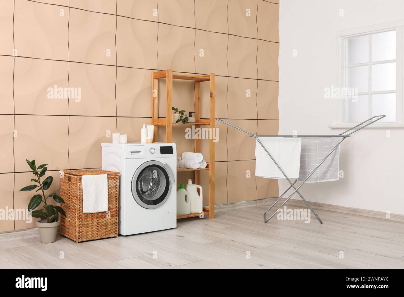 Interior of room with laundry basket, washing machine and dryer Stock ...