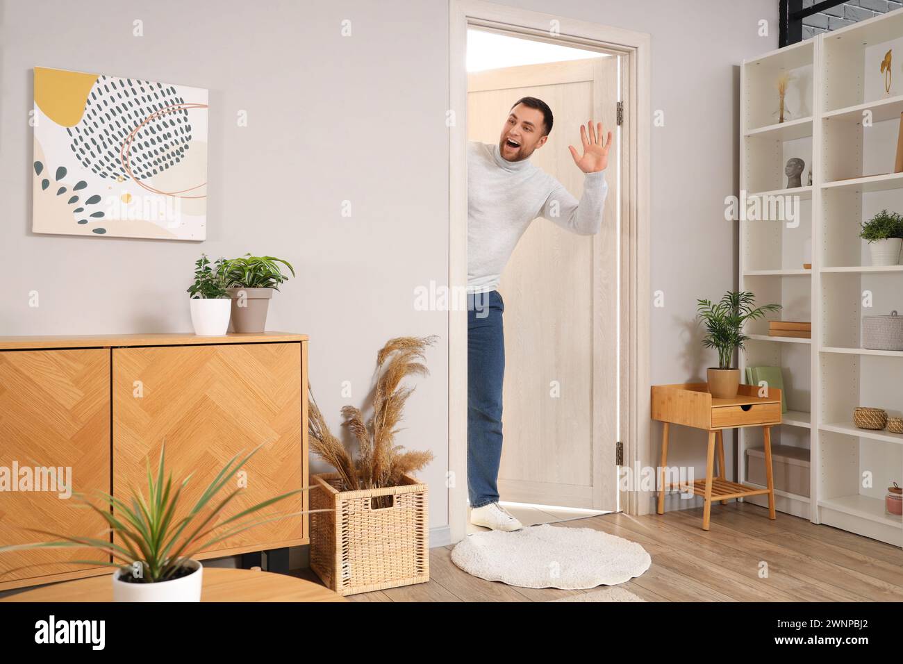 Peeking out door hi-res stock photography and images - Alamy