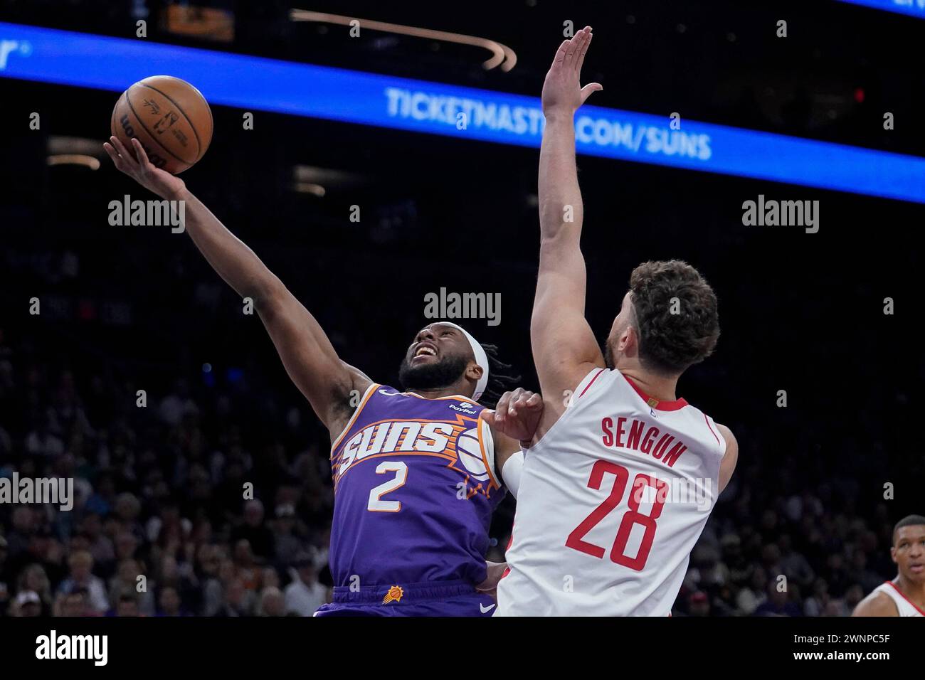 Phoenix Suns forward Josh Okogie (2) shoots over Houston Rockets center ...