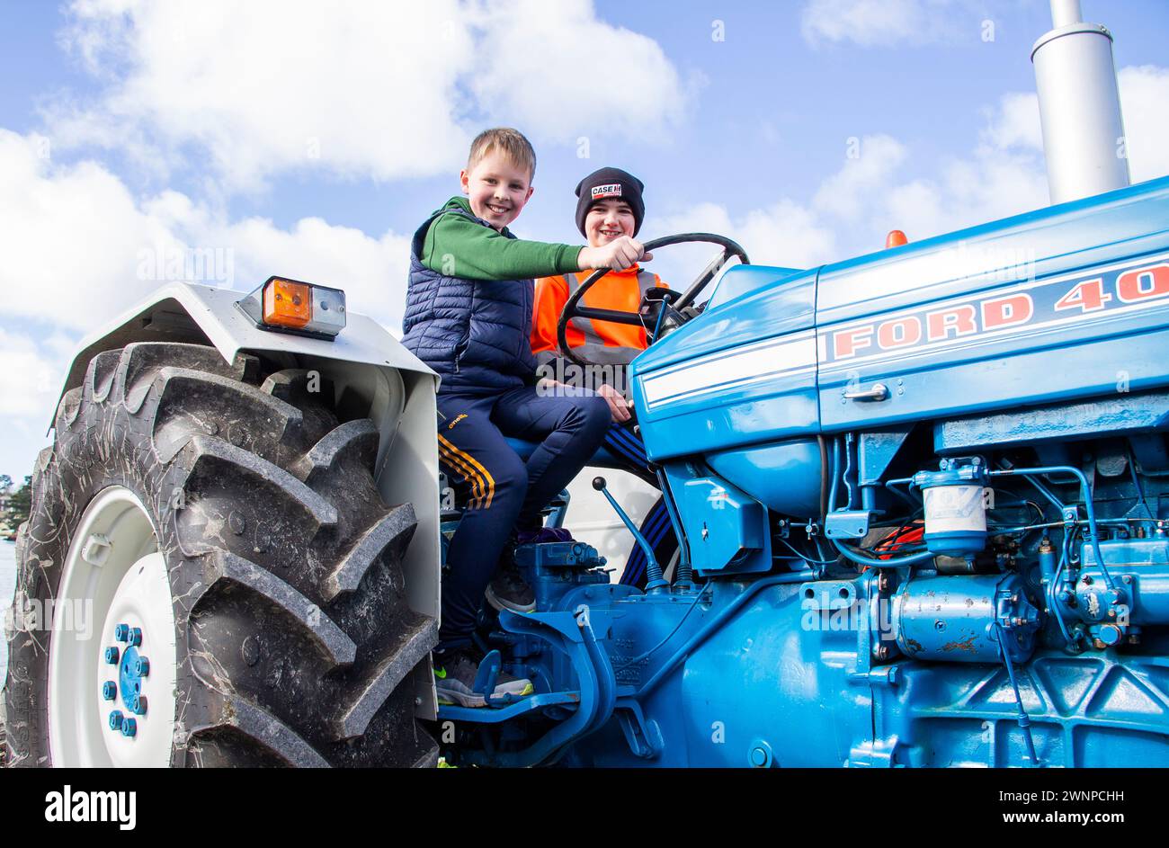 2 young boys sat on Ford 4000 Tractor Stock Photo - Alamy
