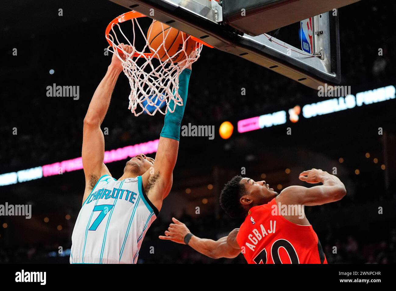 Charlotte Hornets guard Bryce McGowens (7) slam-dunks over Toronto ...