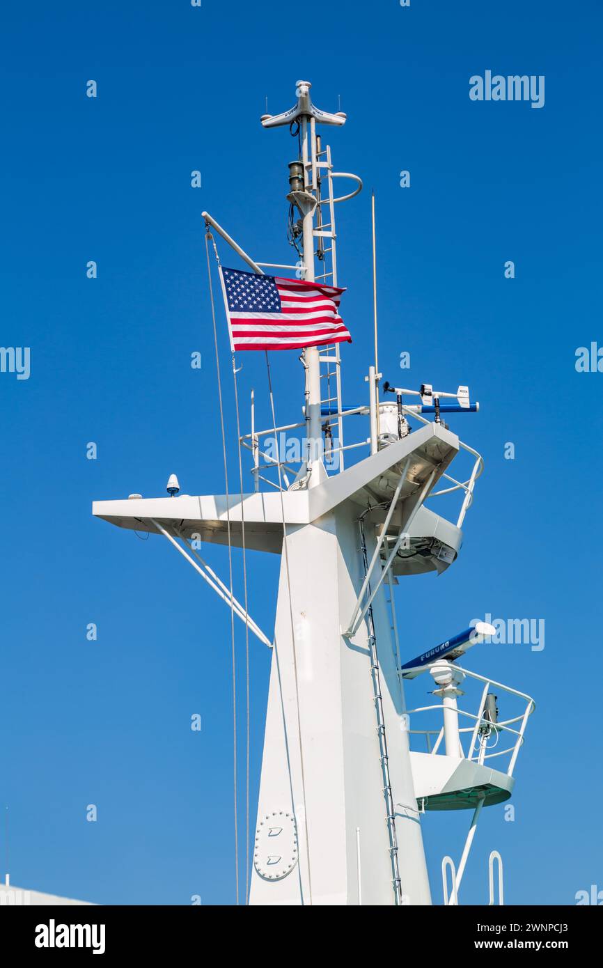 American Flag filying on a communications mast of a ship Stock Photo ...