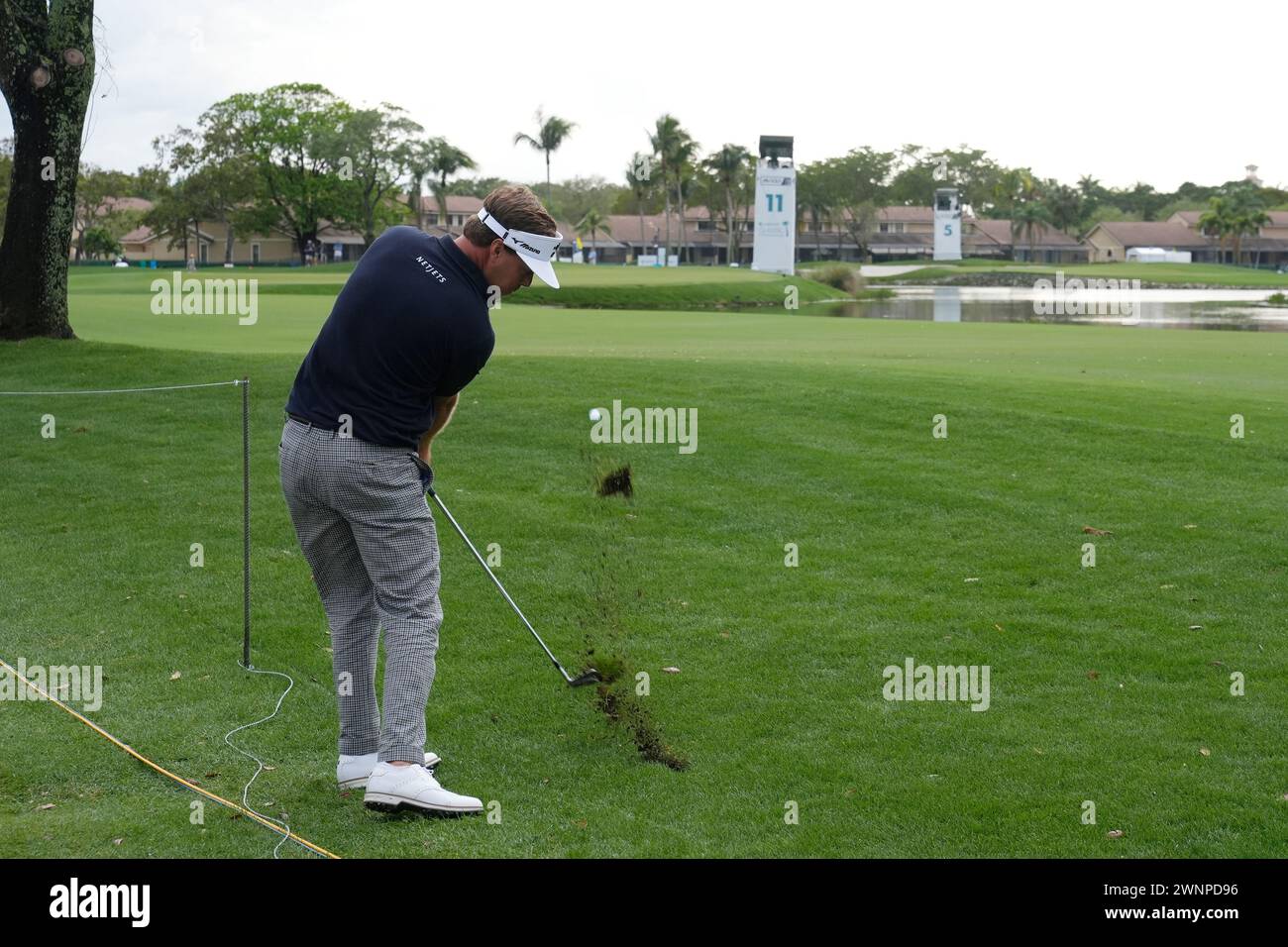 Keith Mitchell hits from the rough on the 11th hole during the final ...