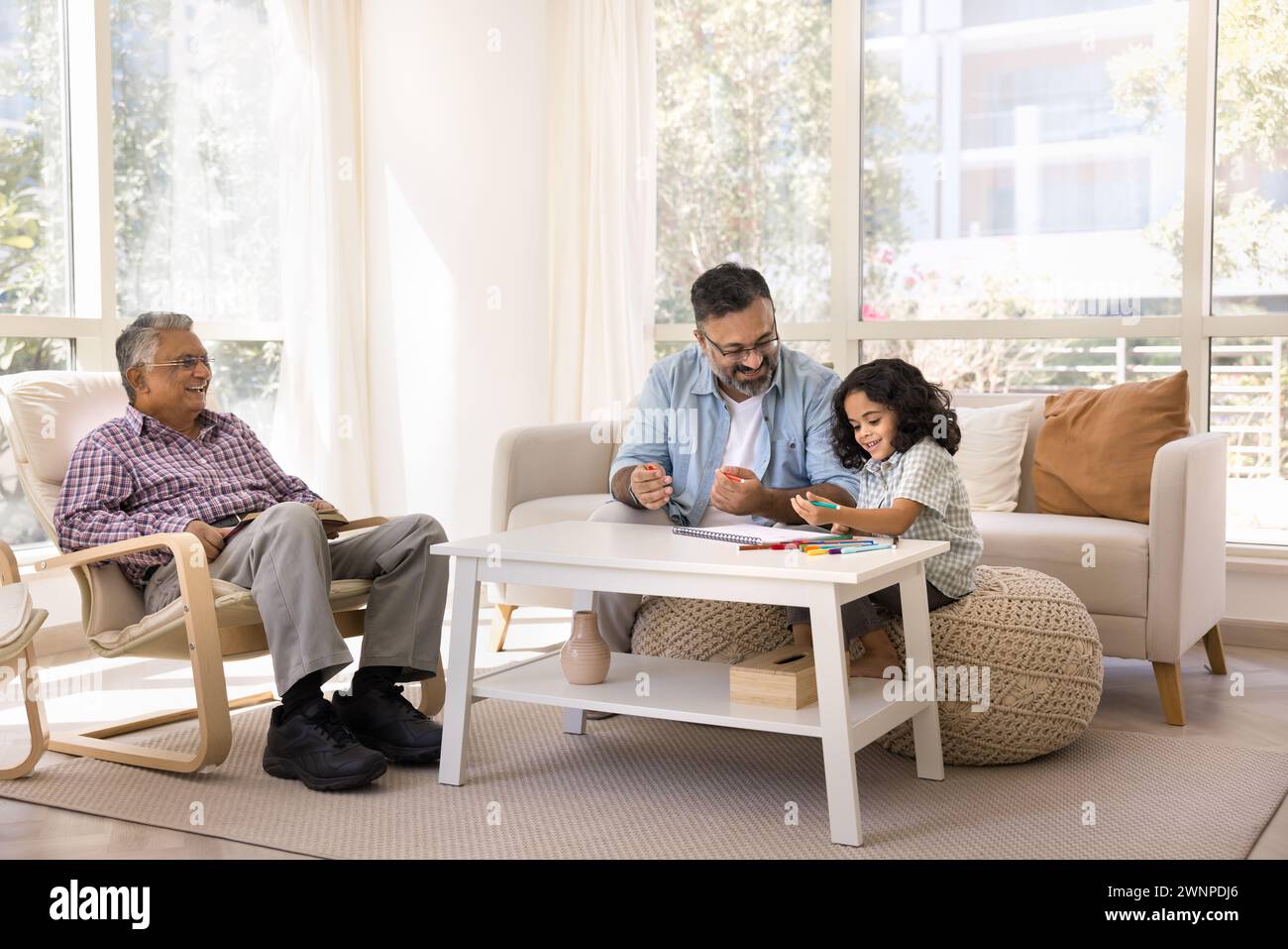 Happy Indian grandpa and granddaughter girl drawing in paper album ...