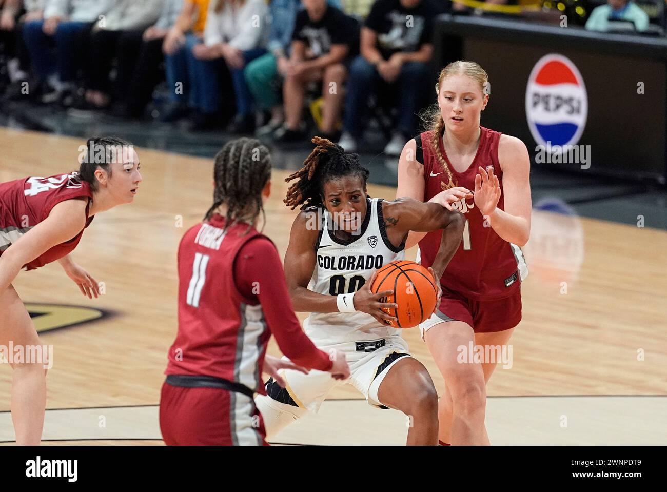 Colorado guard Jaylyn Sherrod drives to the basket between Washington ...