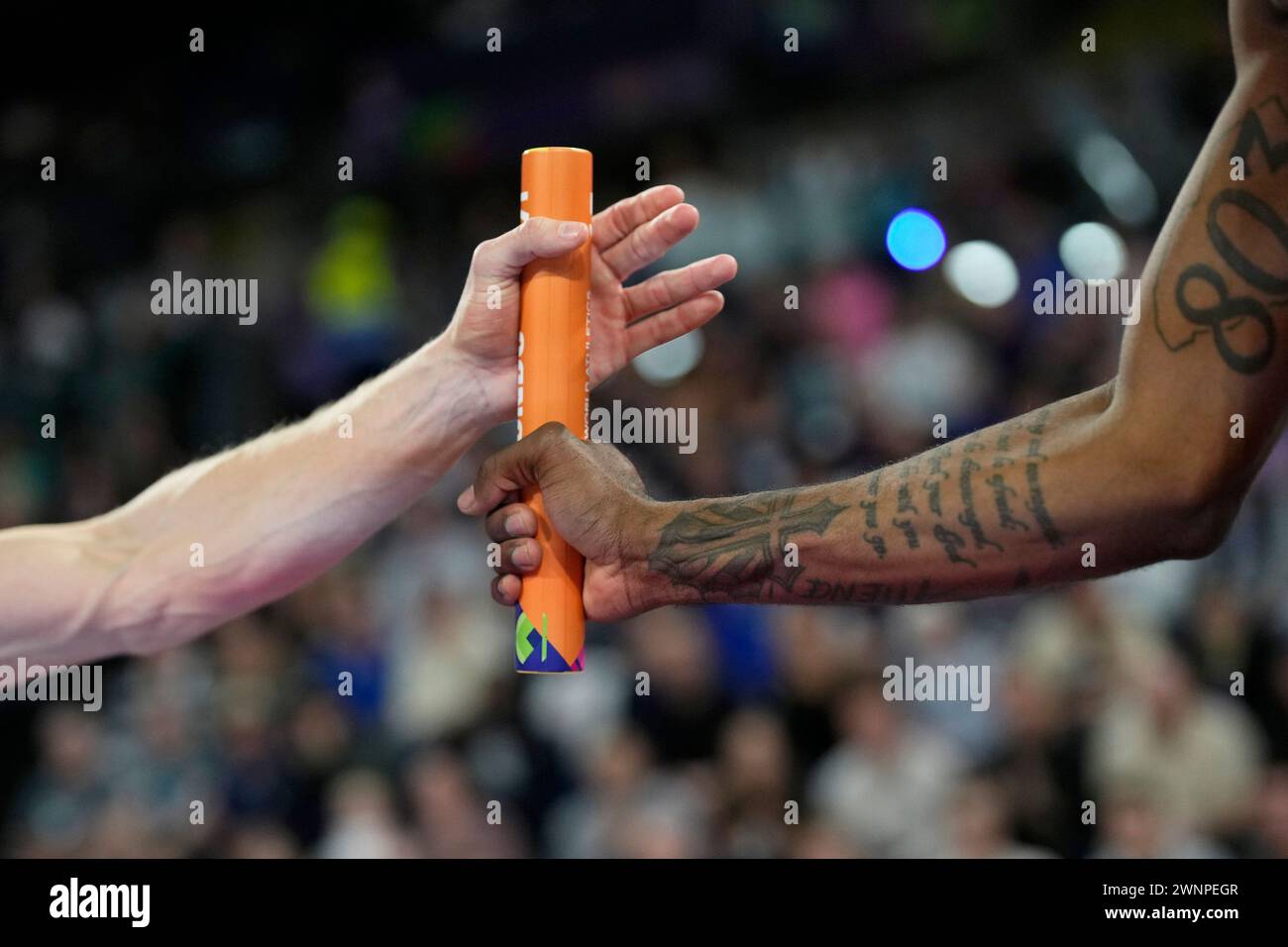 Matthew Boling of Team United States receives the baton from teammate ...