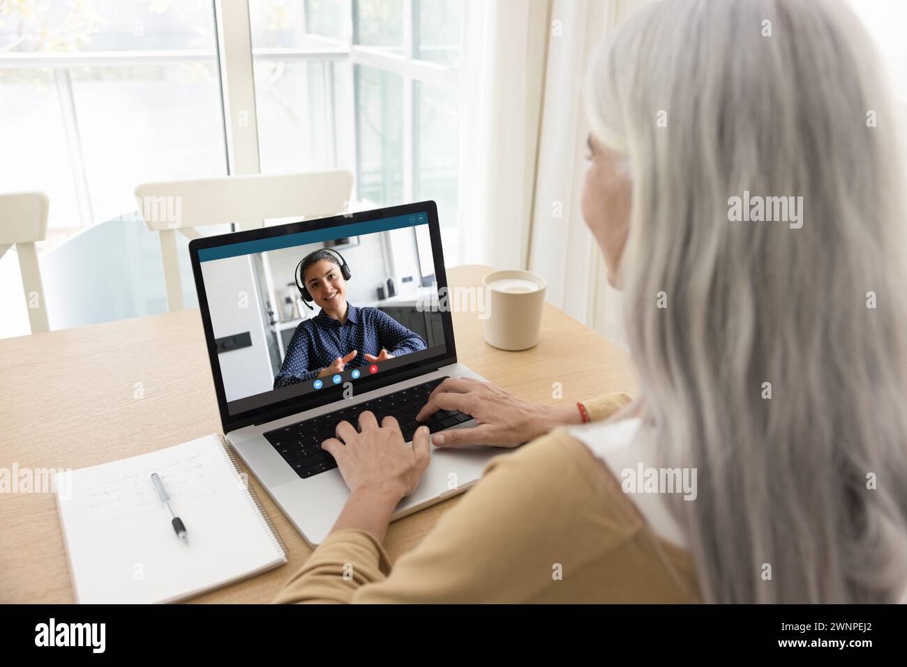 Positive young Indian woman in headset giving webinar, lecture Stock ...
