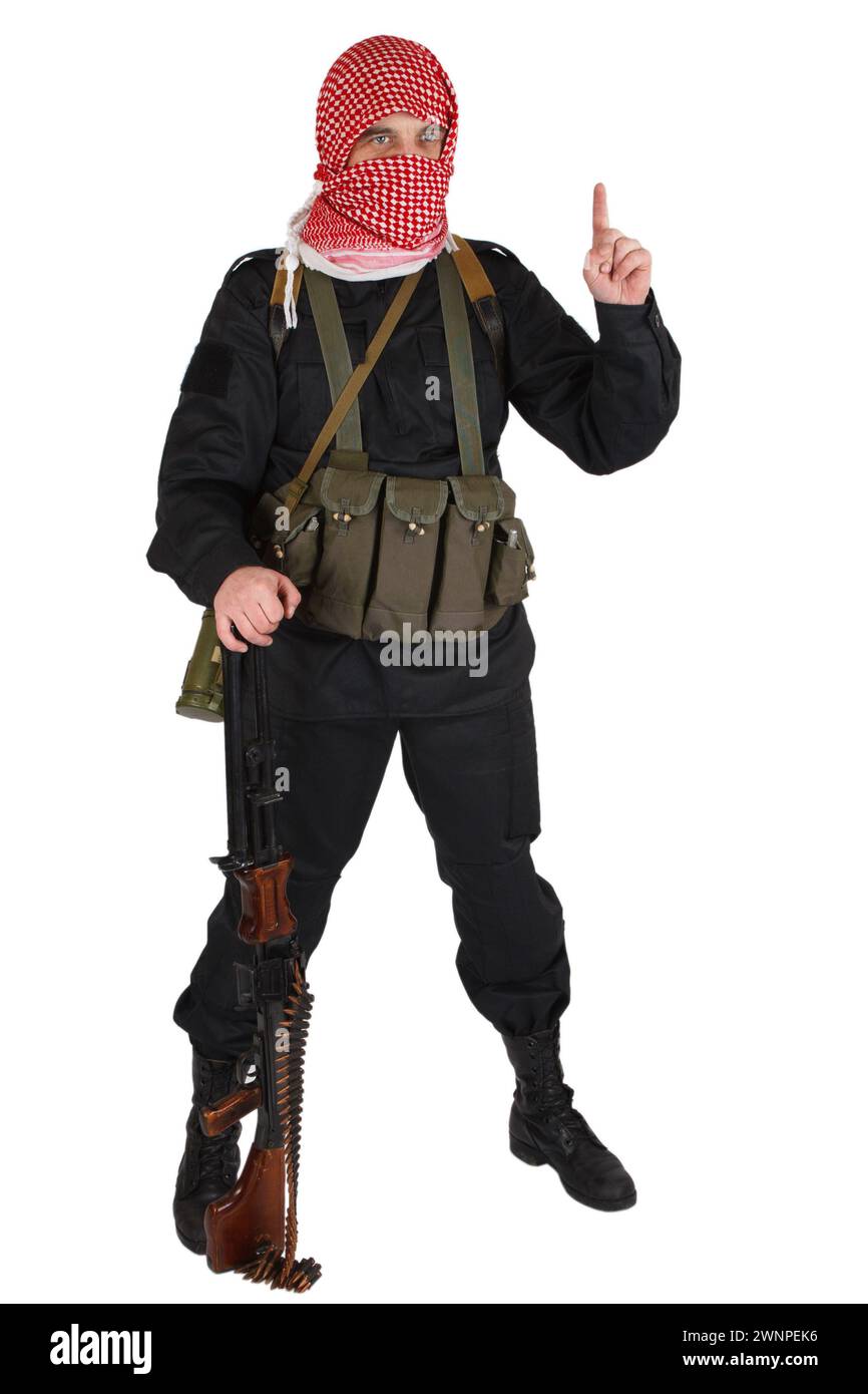 religious paramilitary insurgent with in black uniform with red kufiya ...