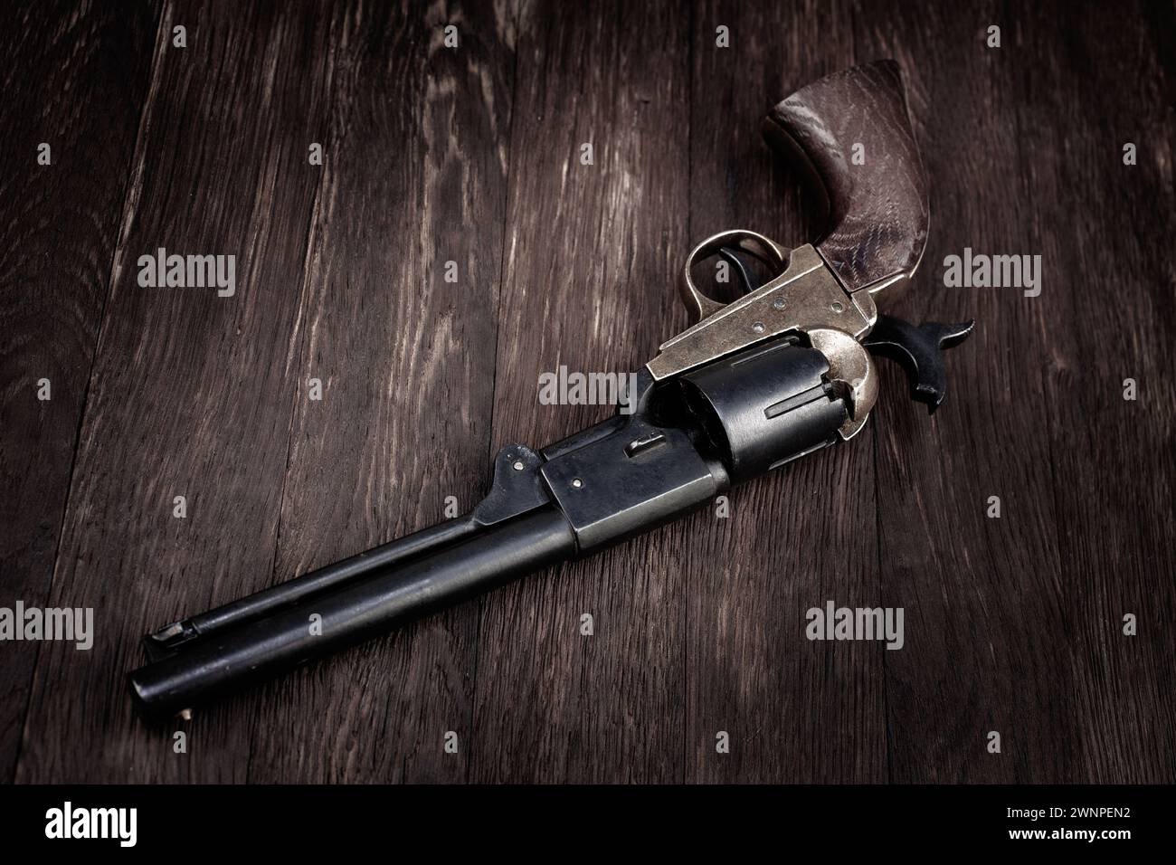 Old West gun. Percussion Army Revolver on wooden table Stock Photo - Alamy