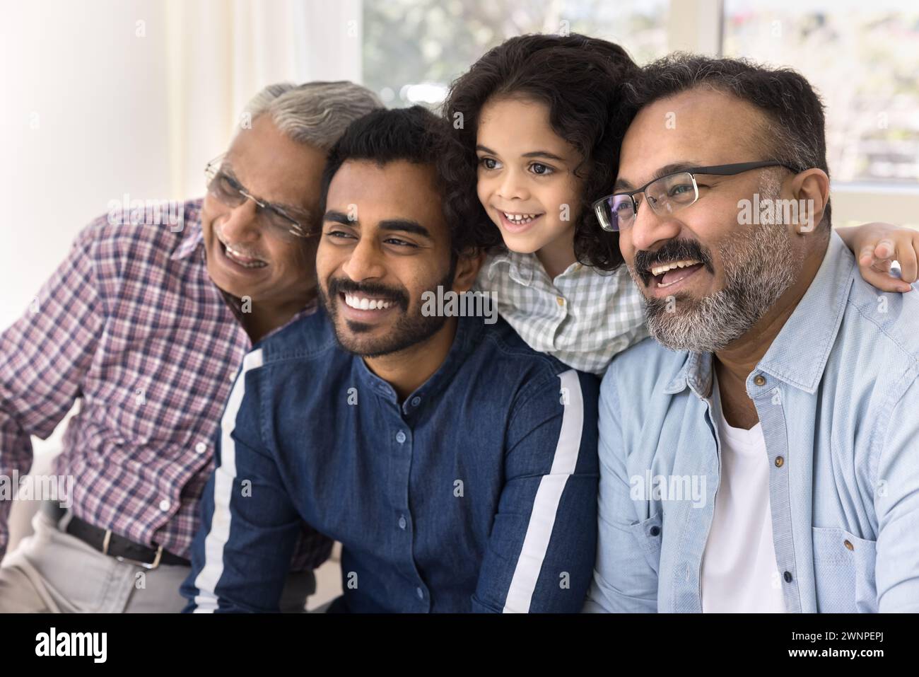 Happy Indian family four generations meeting and laughing Stock Photo ...