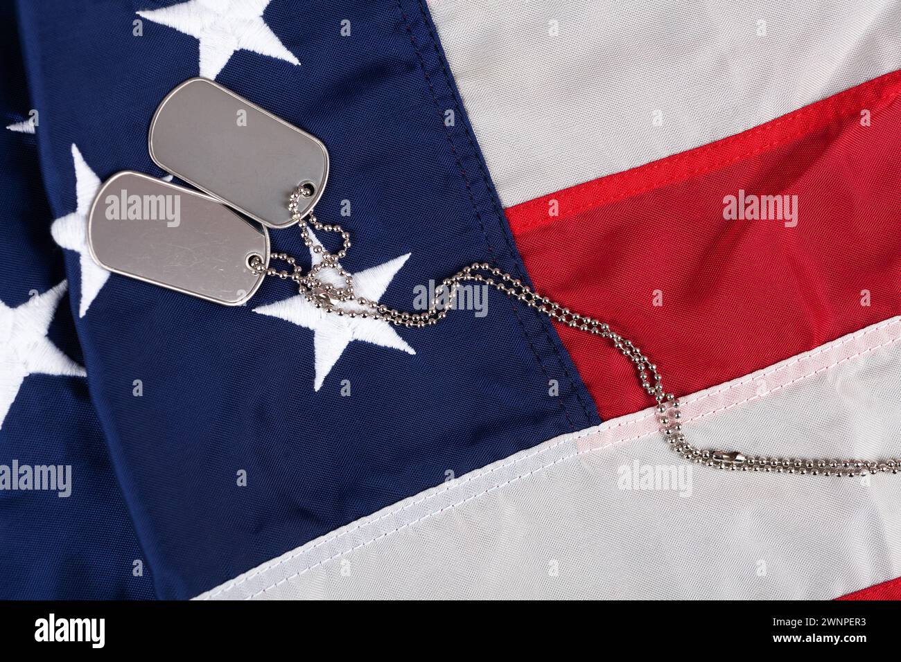 US army dog tags on USA national flag background Stock Photo - Alamy