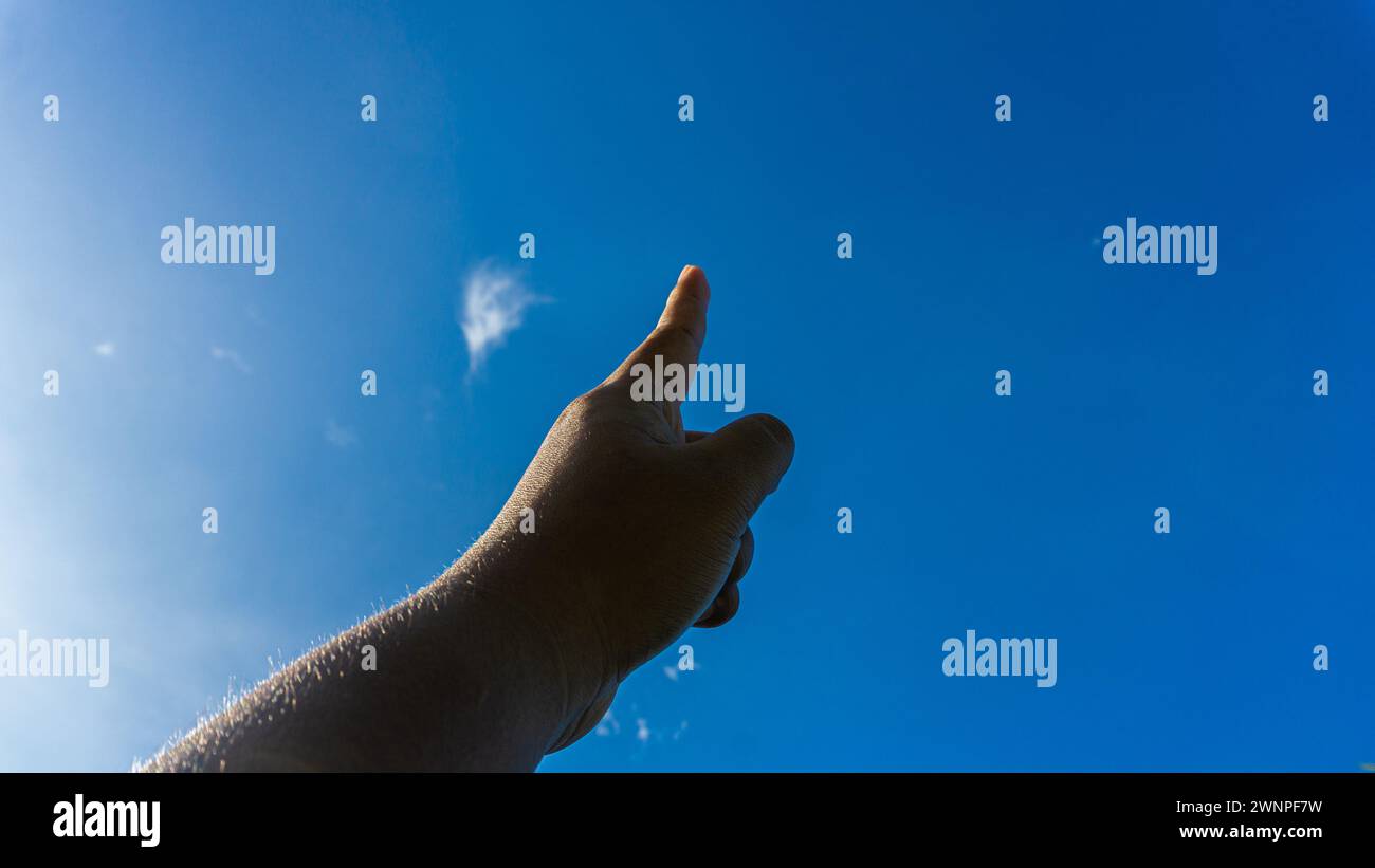 Hand with finger pointing to heaven hi-res stock photography and images ...