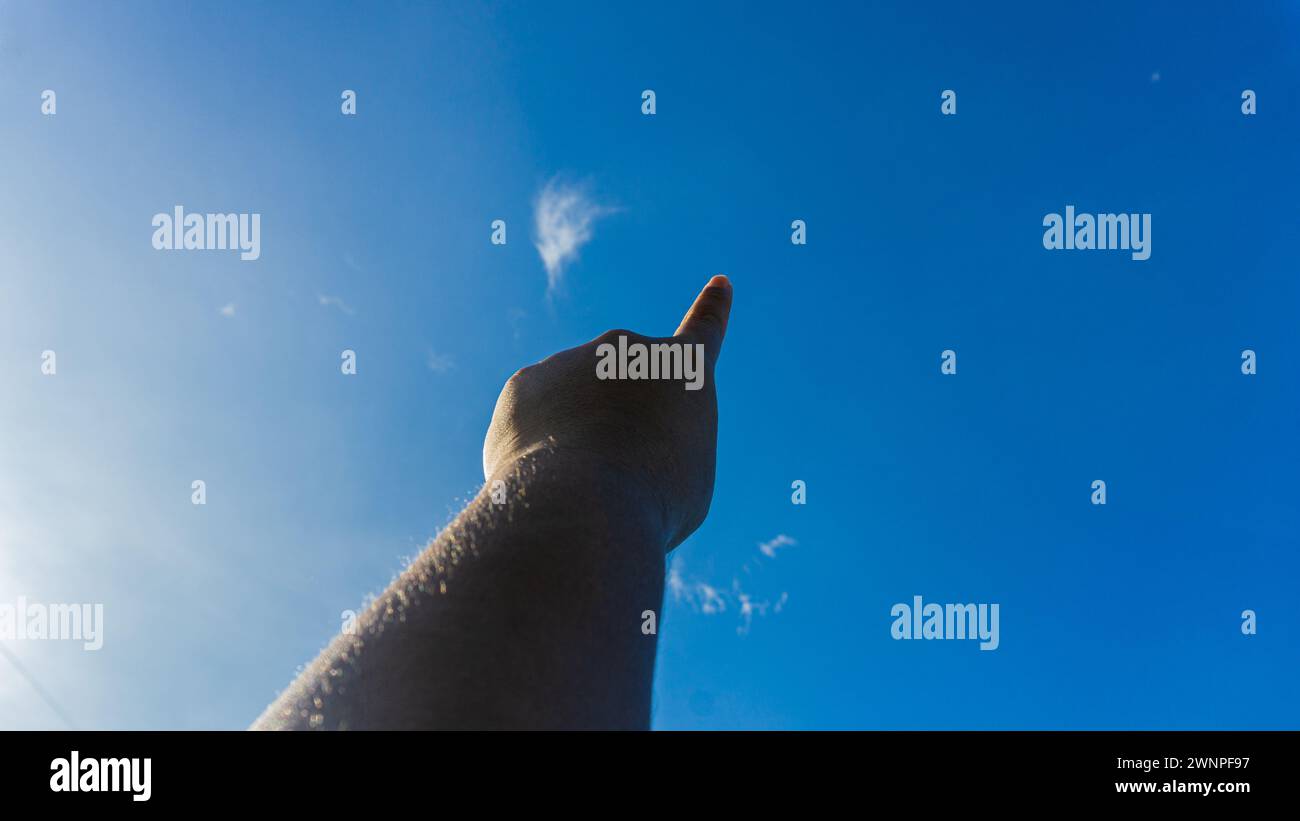 Hand with finger pointing to heaven hi-res stock photography and images ...