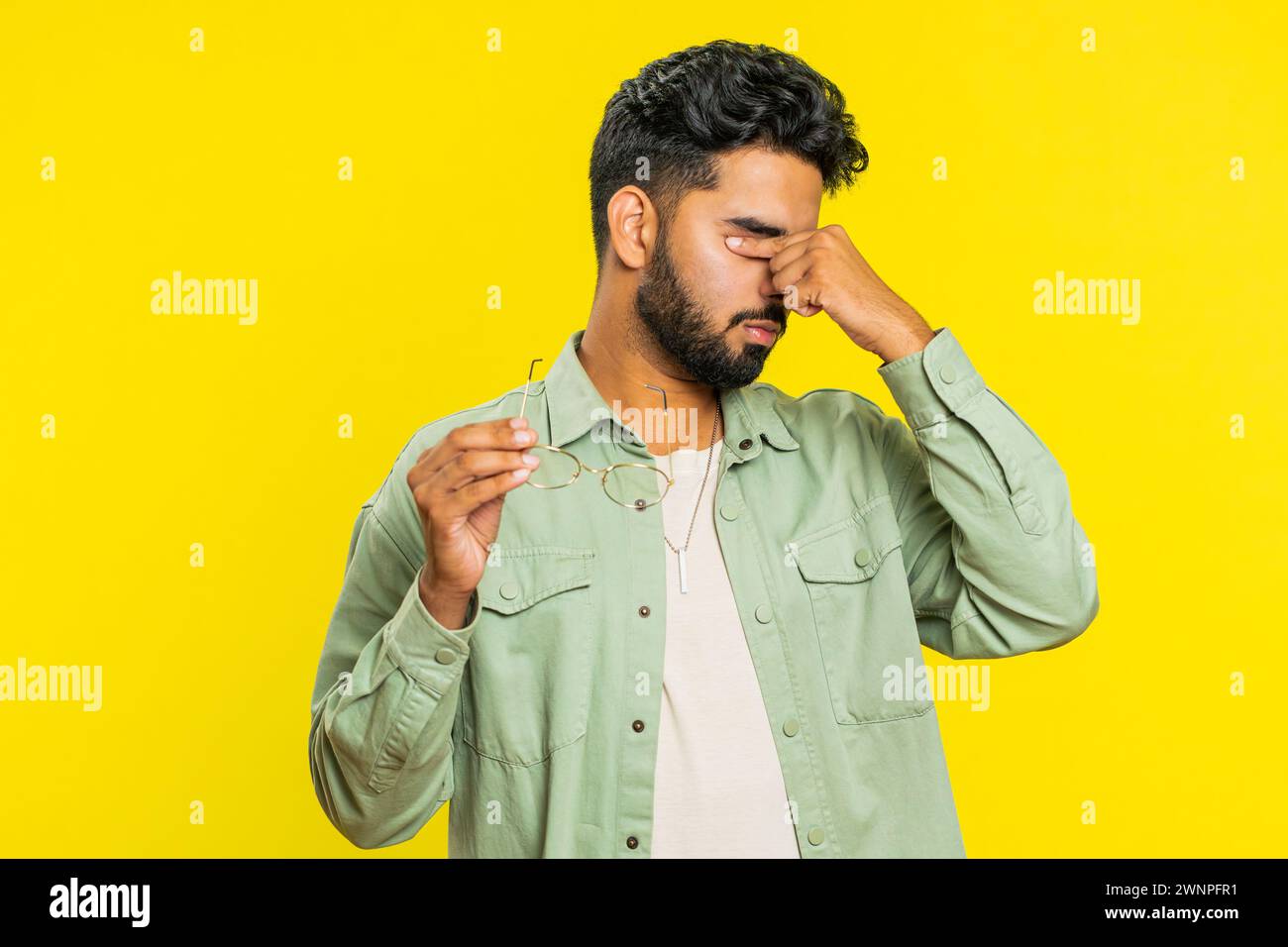 Handsome man feels tired eyes hi-res stock photography and images - Alamy