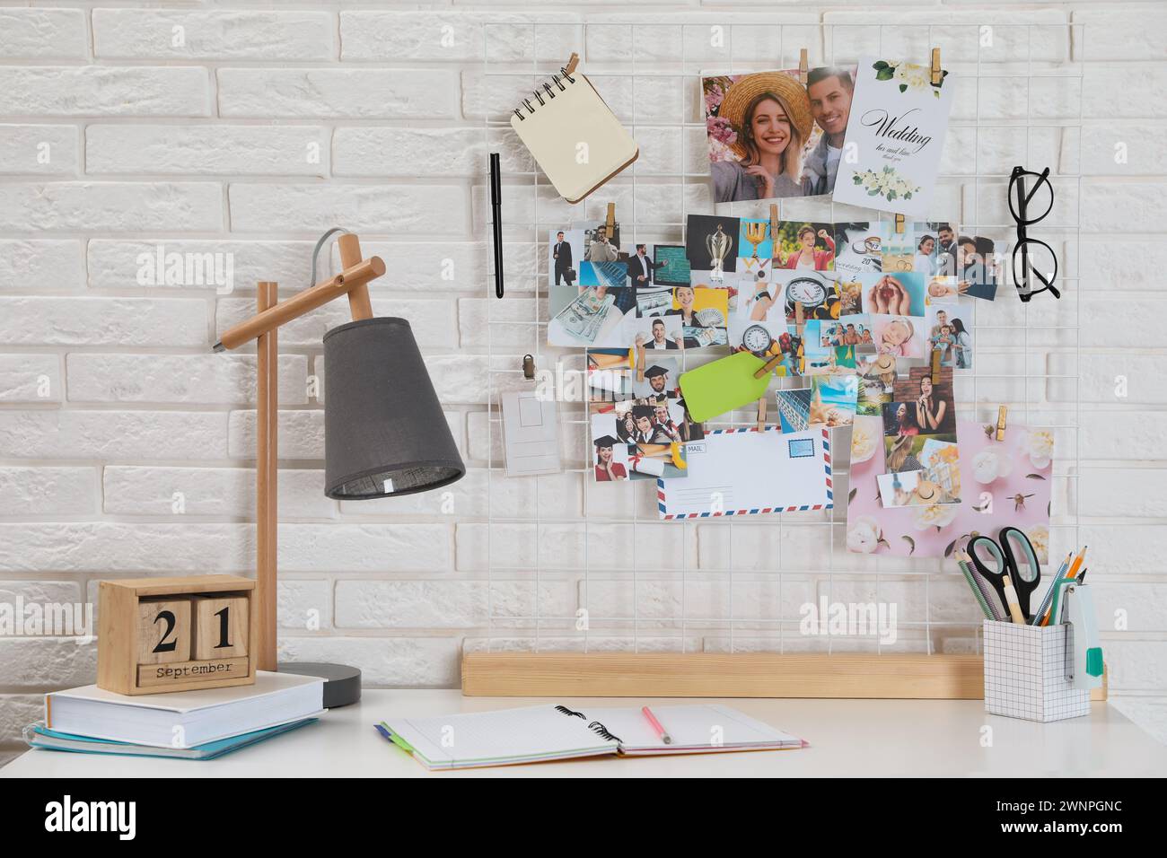Stylish workplace with stationery and vision board Stock Photo - Alamy