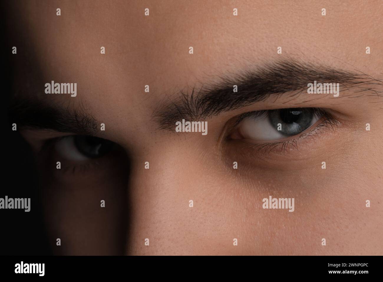 Evil eye. Man with scary eyes, closeup Stock Photo - Alamy