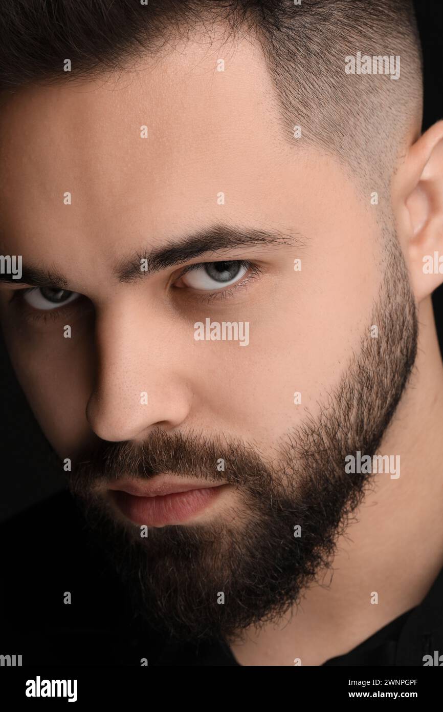 Evil eye. Man with scary eyes on black background Stock Photo - Alamy