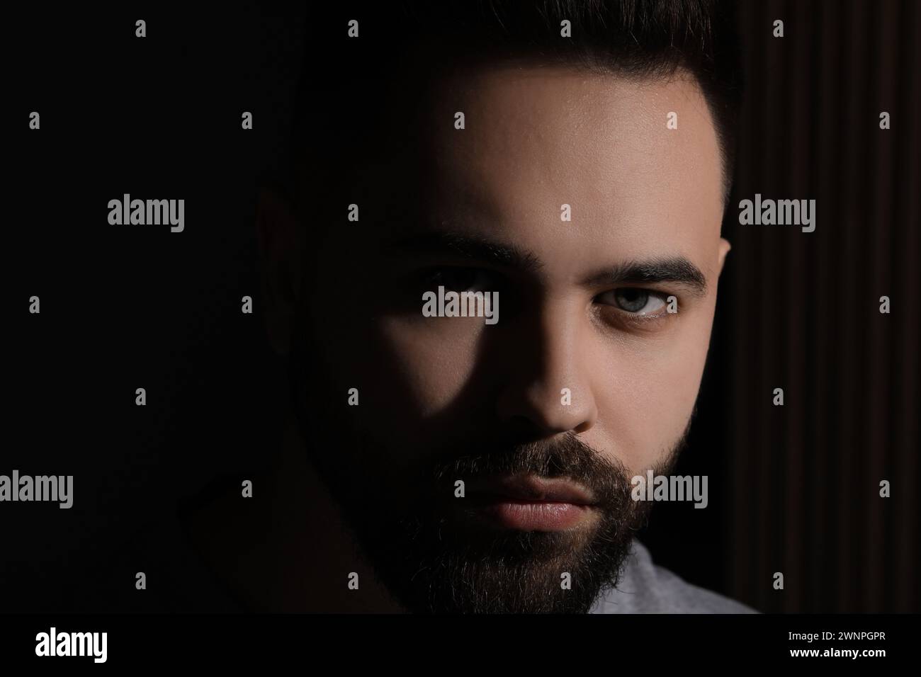 Evil eye. Man with scary eyes on black background Stock Photo - Alamy