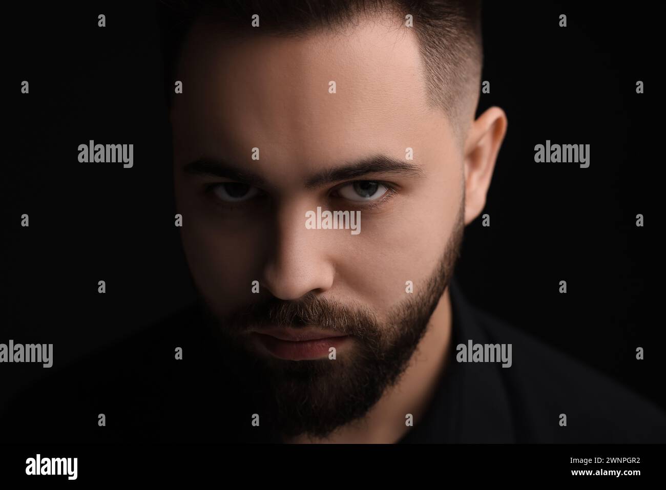 Evil eye. Man with scary eyes on black background Stock Photo - Alamy