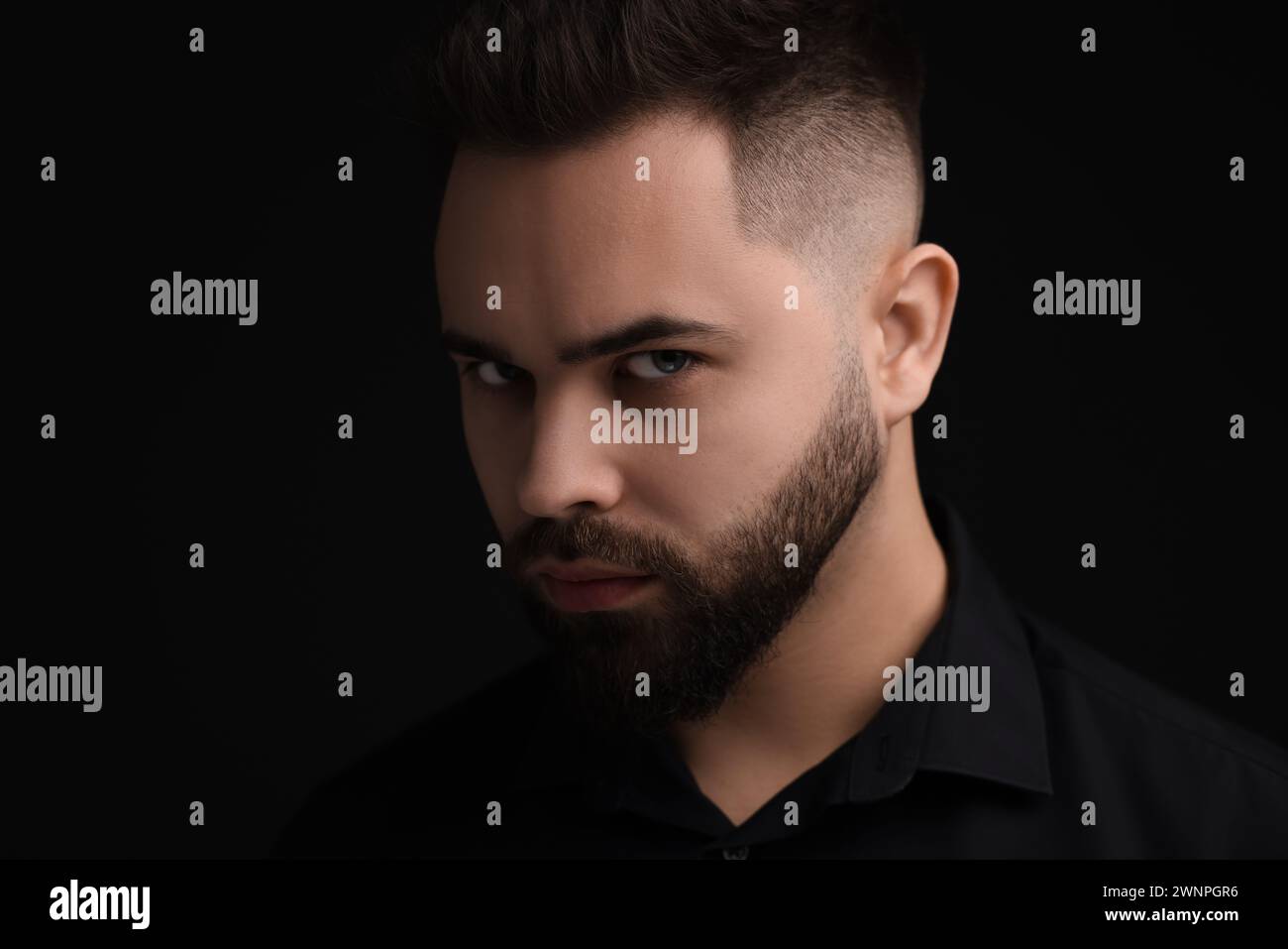 Evil eye. Man with scary eyes on black background Stock Photo - Alamy