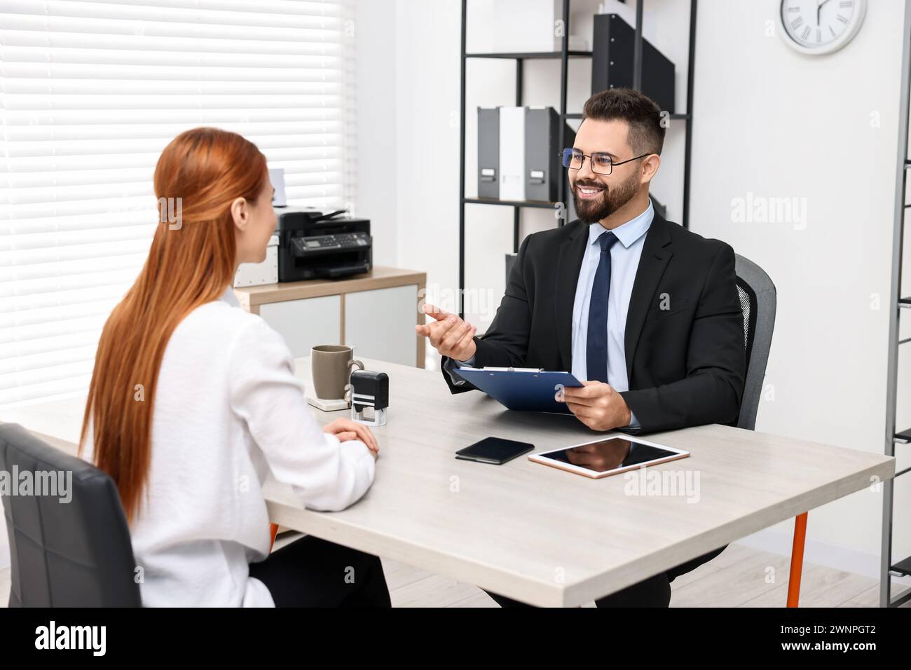Immigration. Woman having interview with embassy worker in office Stock ...