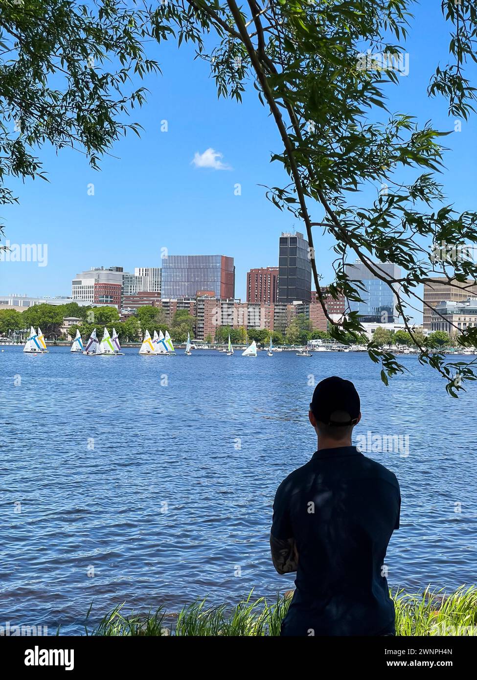 A warm spring day draws people to Boston’s Esplanade along the Charles ...